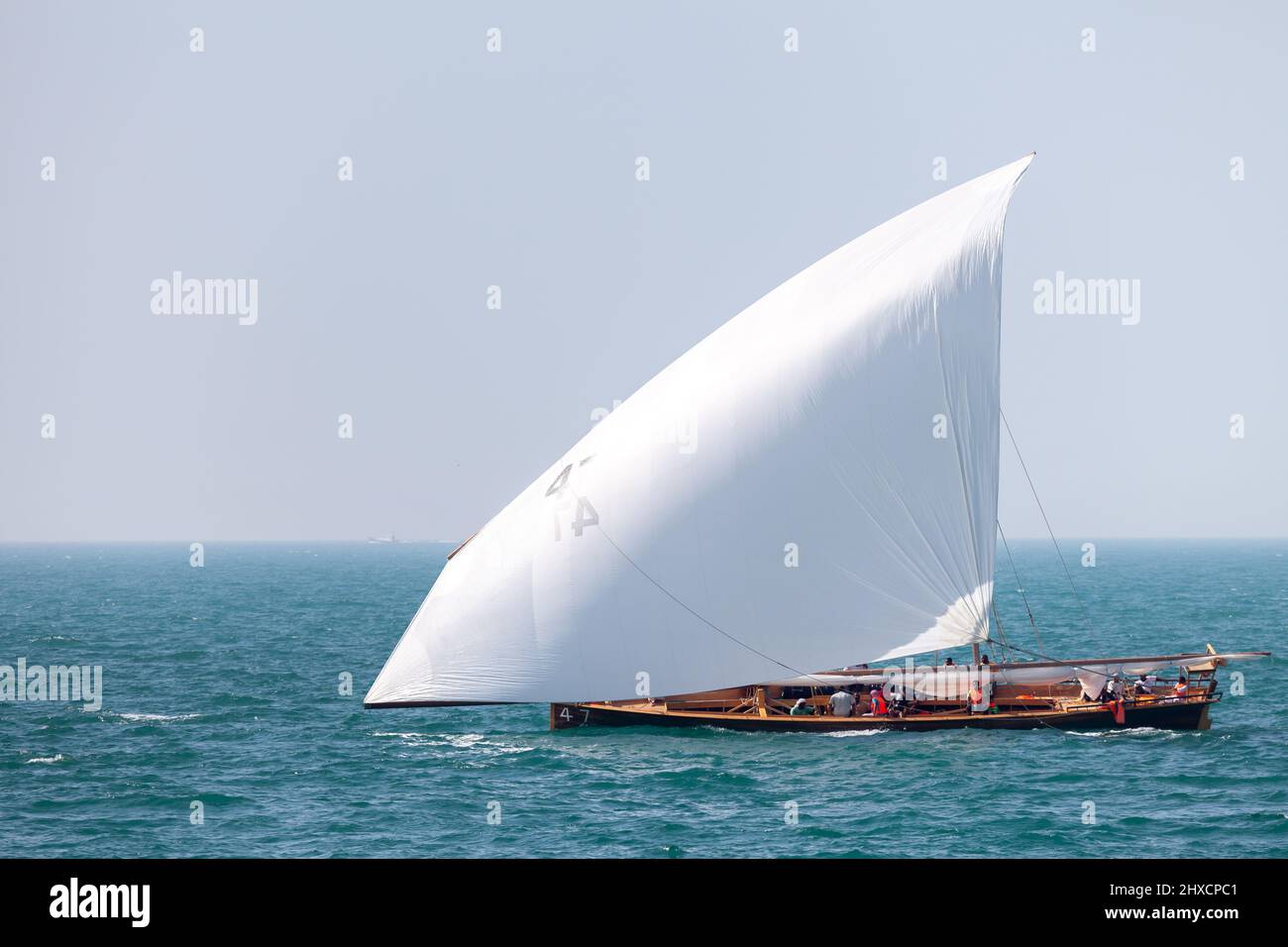 Abu Dhabi, UAE - March 17, 2013: Traditional 60 feet dhow sailing race ...
