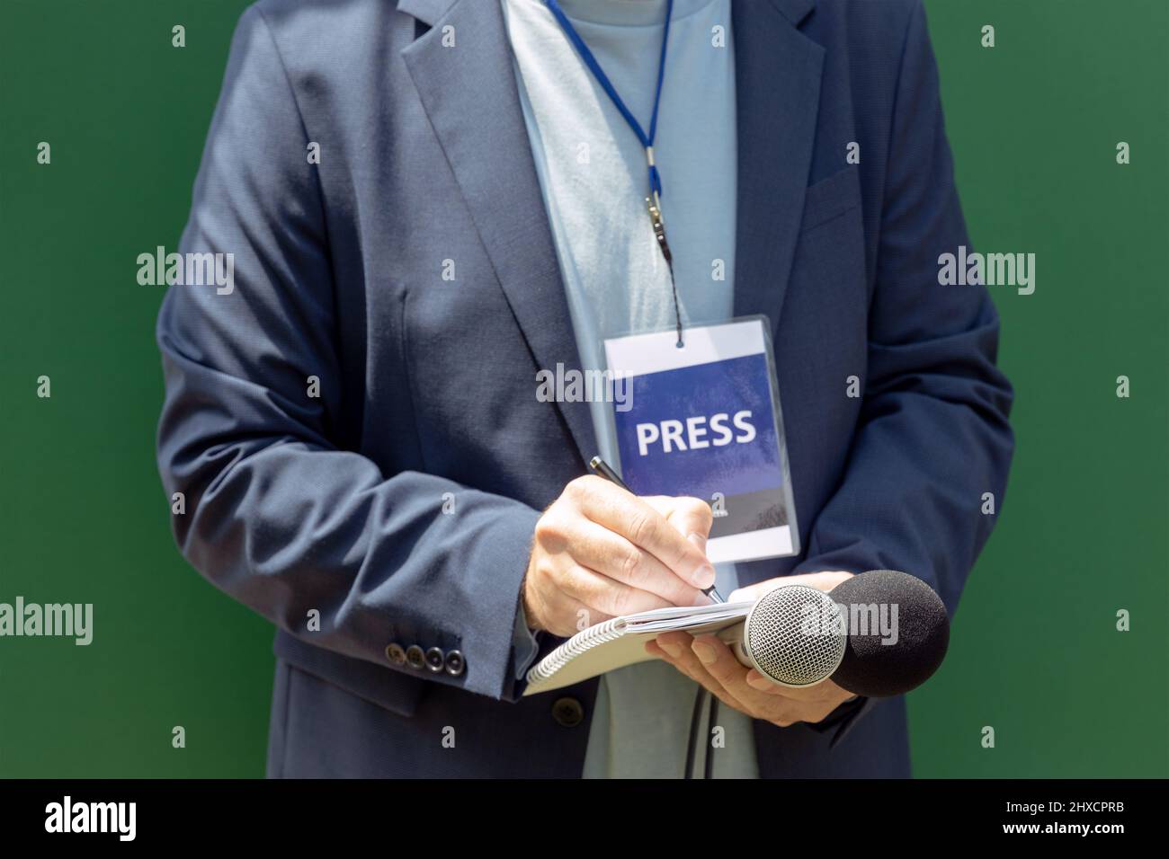 Journalism concept. Journalist wearing press pass at news conference or ...