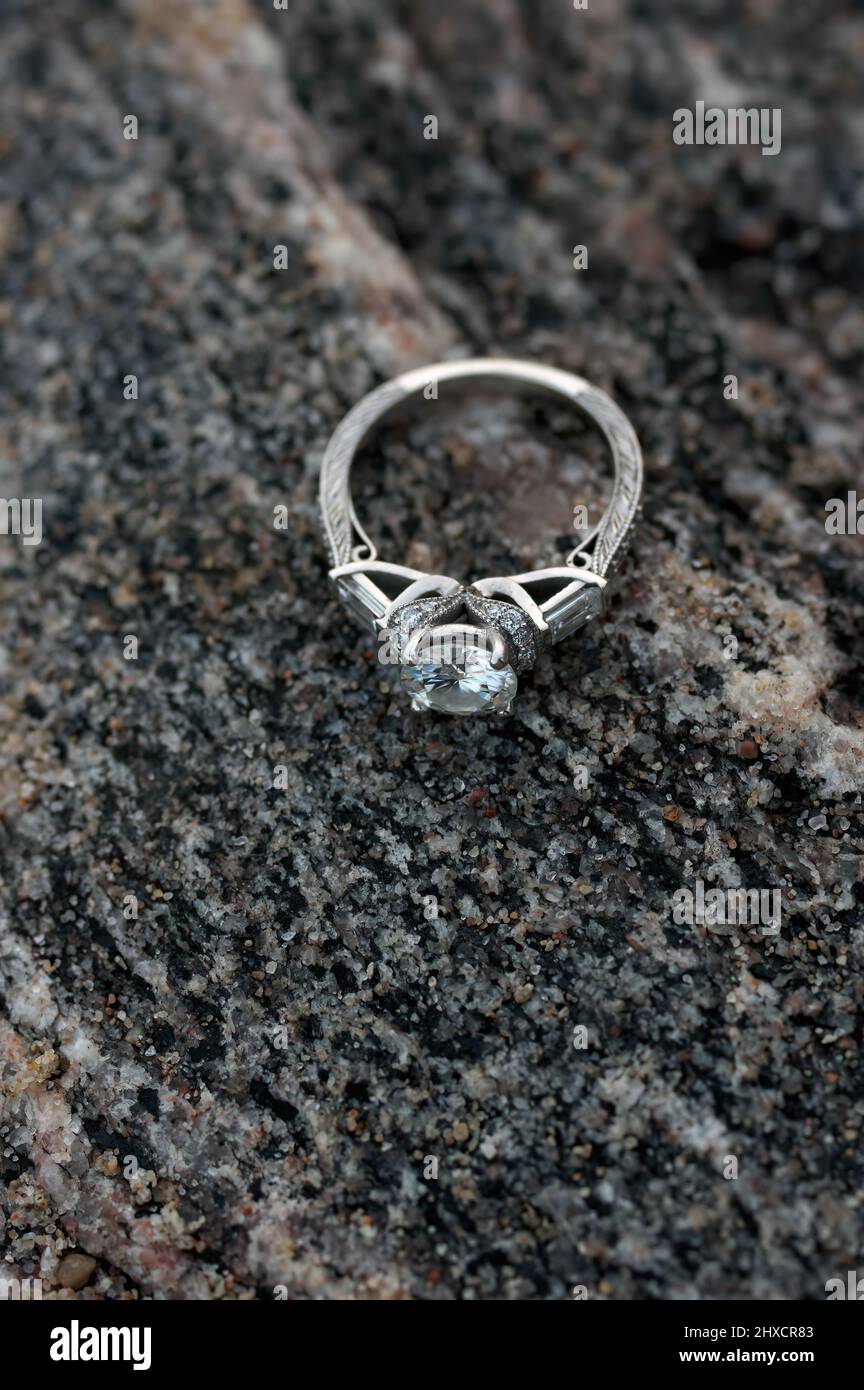 Beautiful Diamond Ring on a dark granite Rock Stock Photo - Alamy