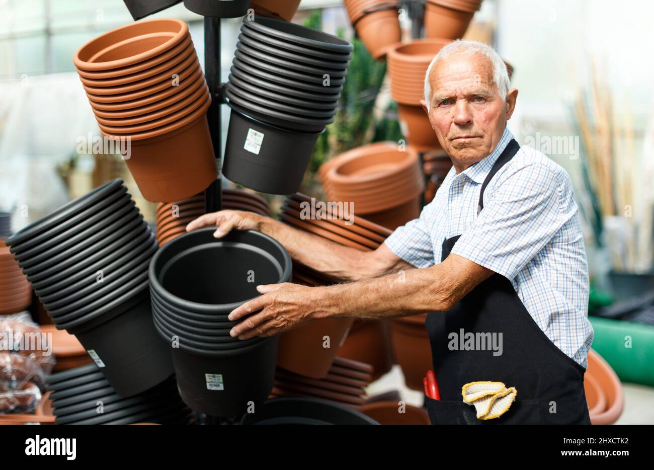 Portrait man choosing pots hi-res stock photography and images - Alamy