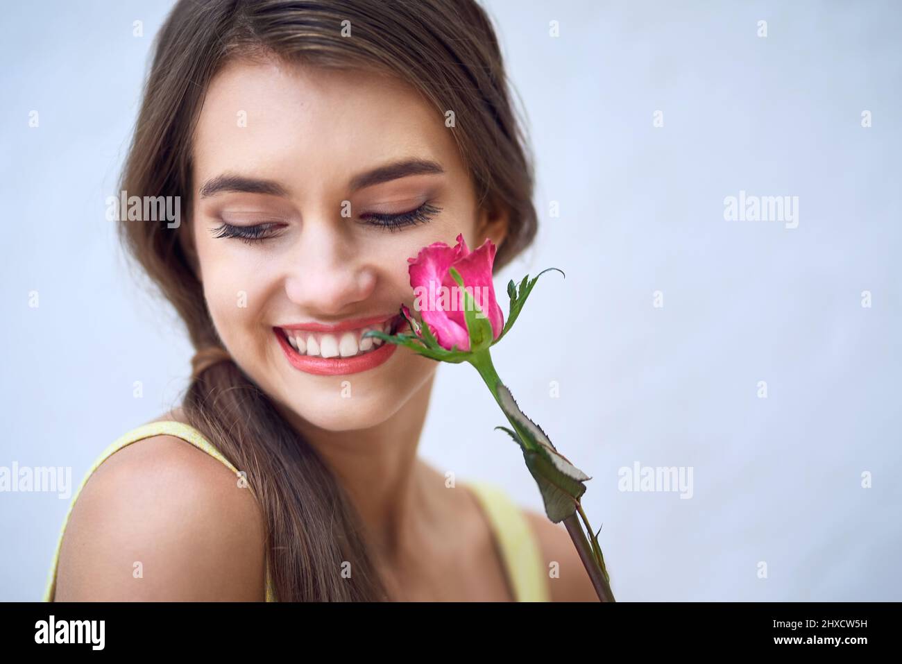 Two natural beauties. Studio closeup of a cheerful young woman holding ...