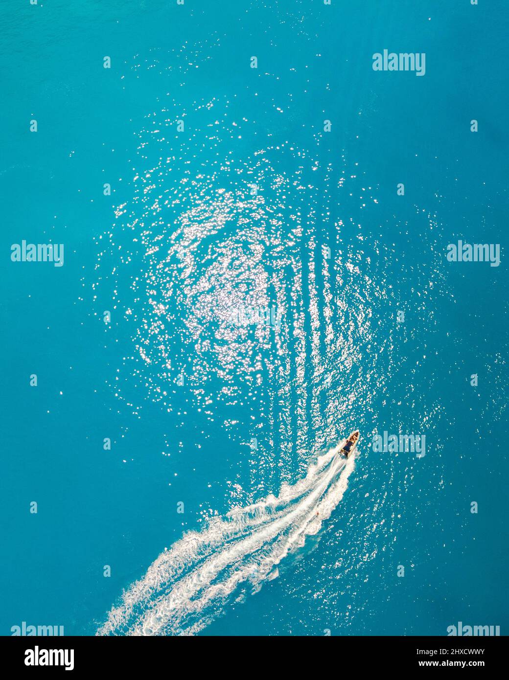 aerial view of speed boat making waves in blue sea water Stock Photo ...