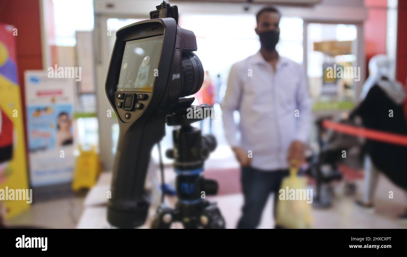 Temperature check at a supermarket, grocery store with a thermal ...