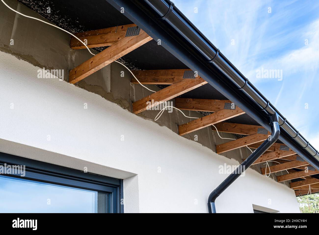 Roof trusses through which the electric cable passes to connect the ...