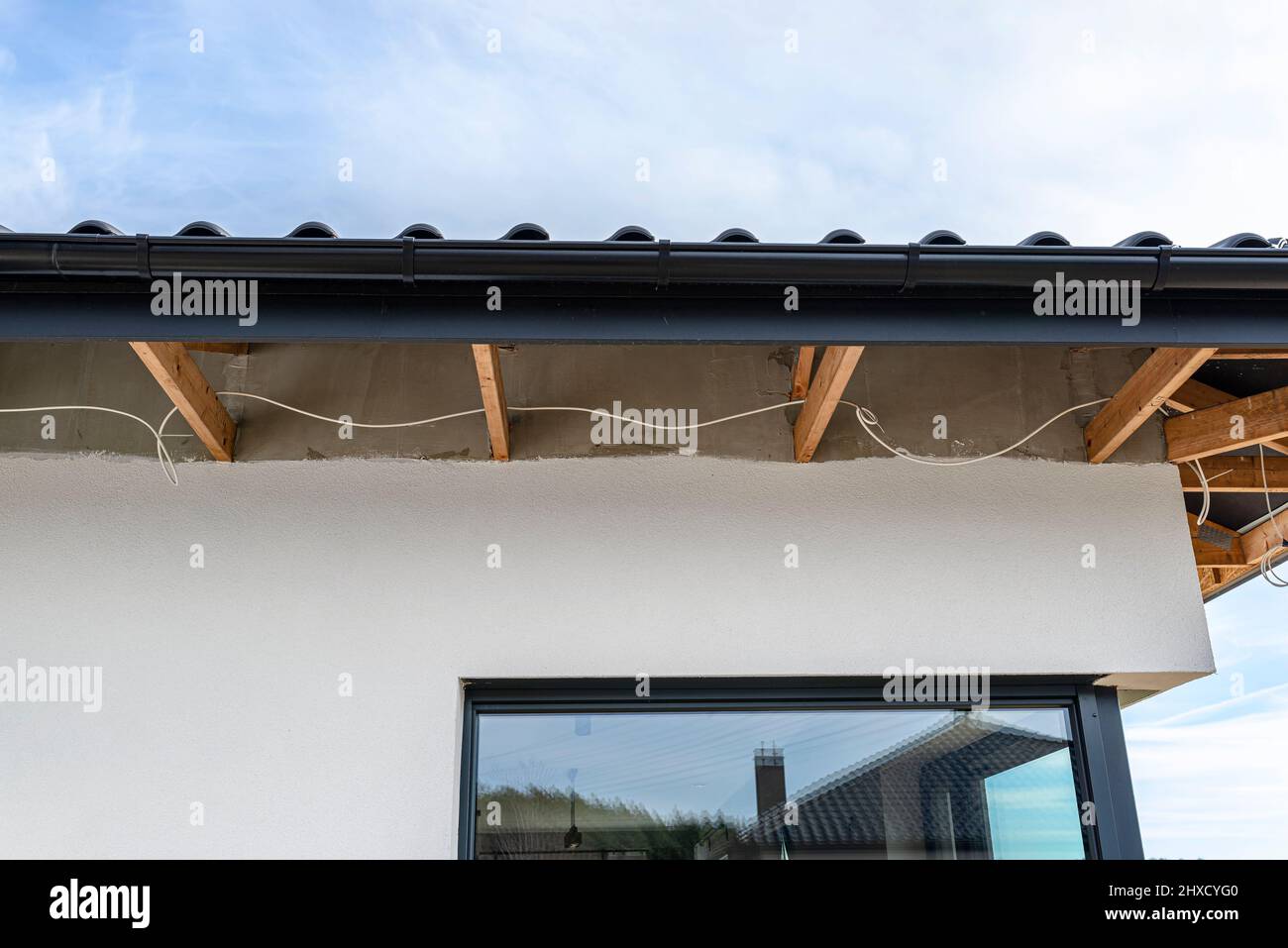 Roof trusses through which the electric cable passes to connect the ...