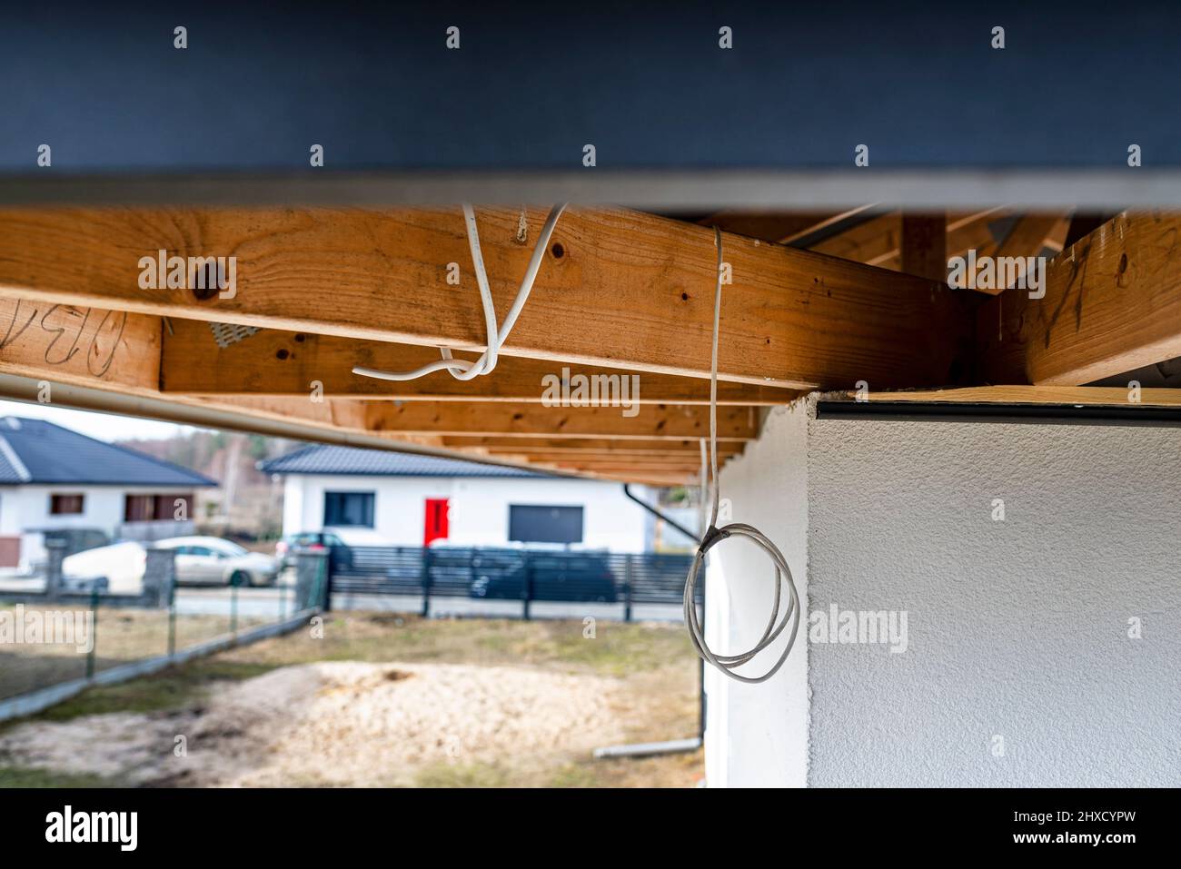 Roof trusses through which the electric cable passes to connect the ...