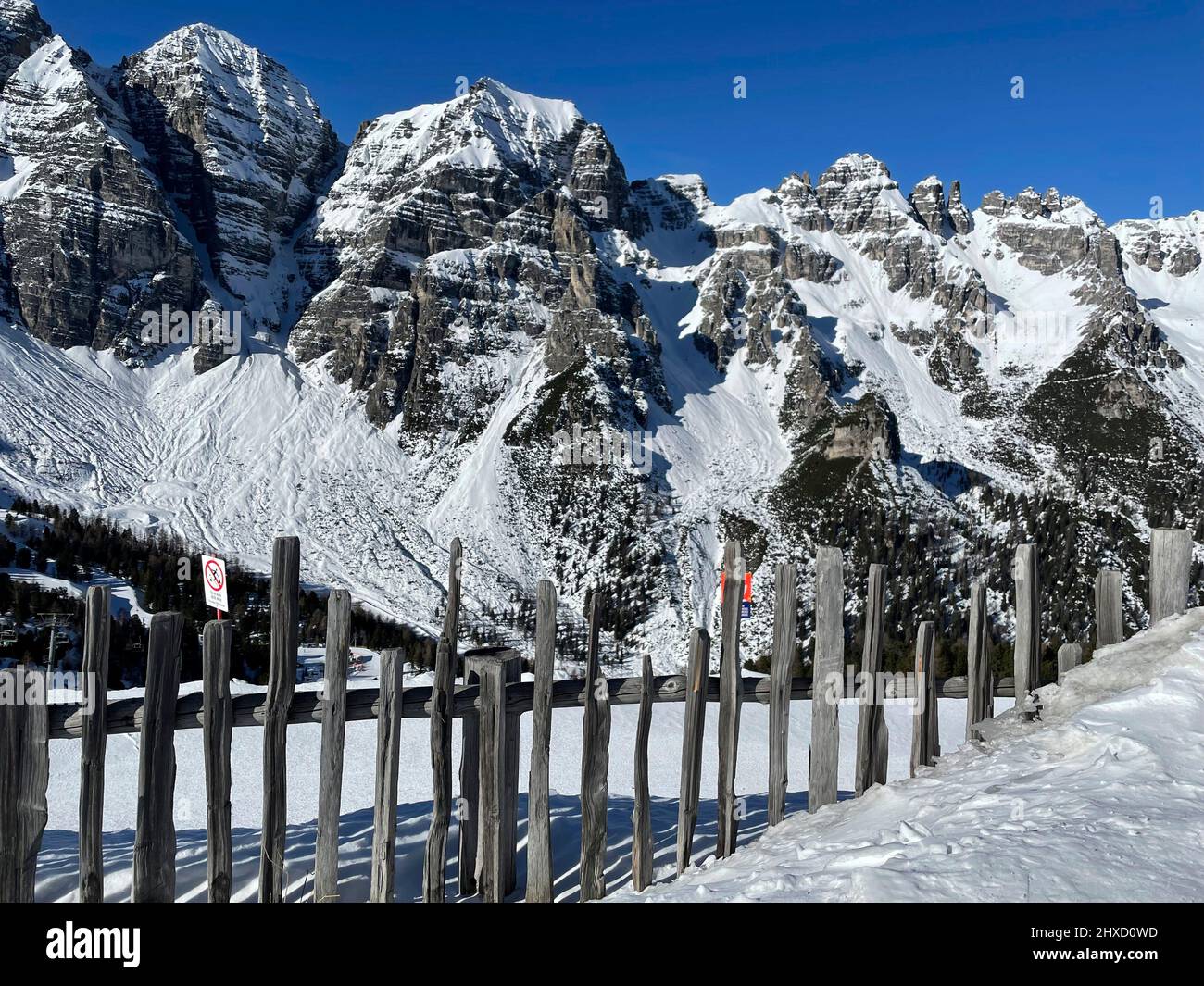 Winter landscape with wooden fence and view of the Schlicker peaks in ...