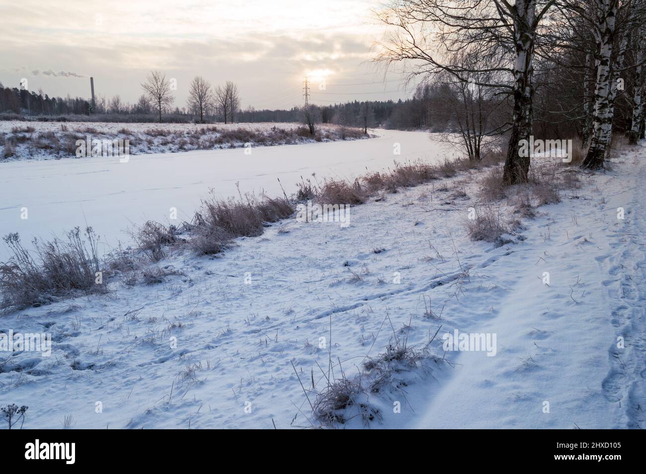 Moody winter landscape in Helsinki, Finland. A frozen river in the ...