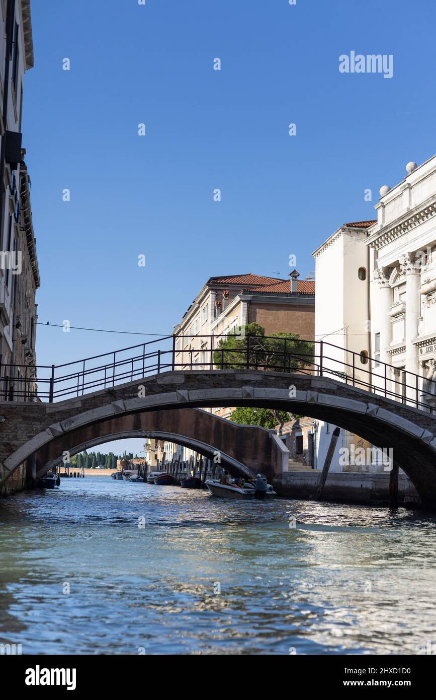 Two small bridges over a canal in Castello neighborhood overlooking San ...