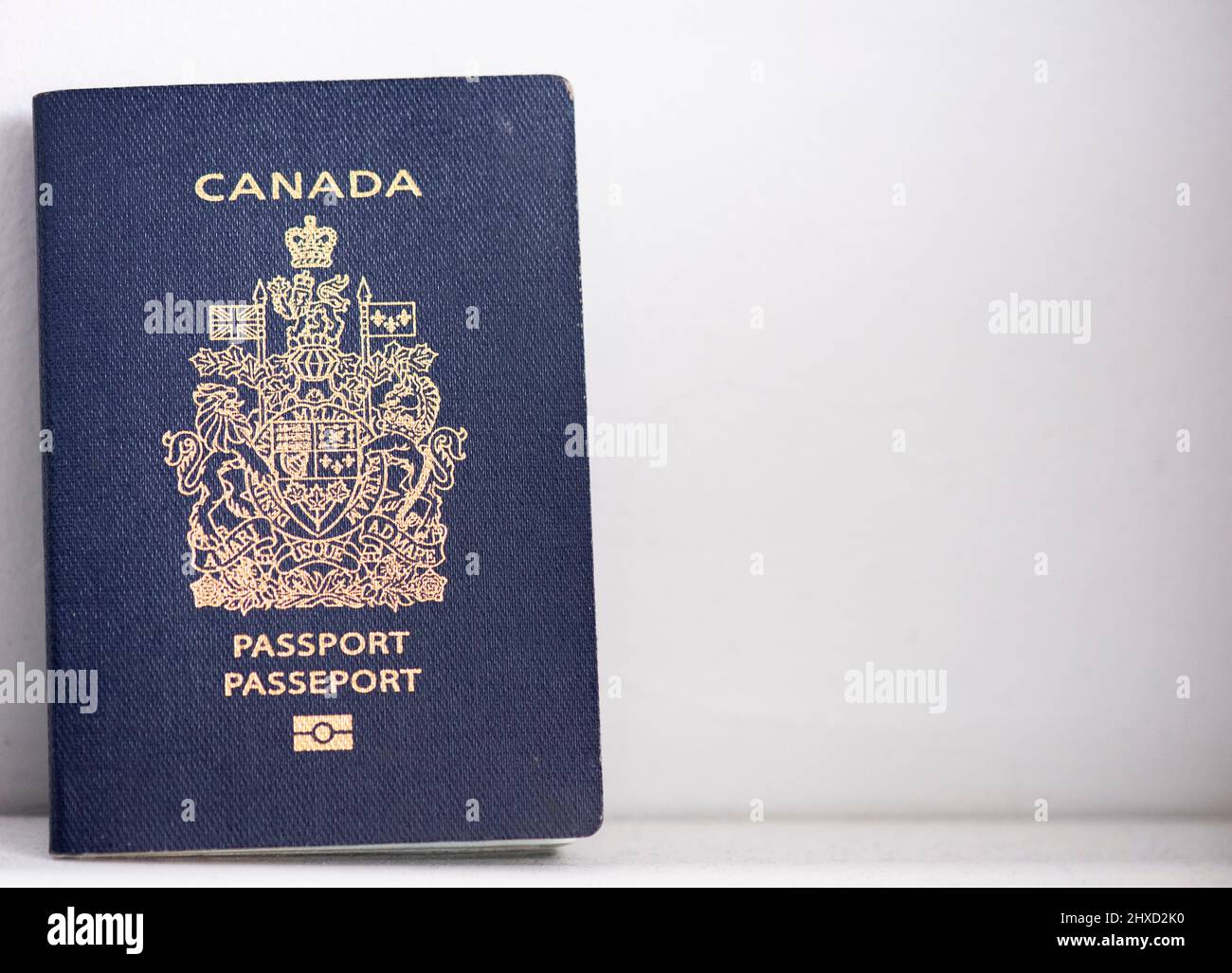 A Canadian passport on a white grey background Stock Photo - Alamy