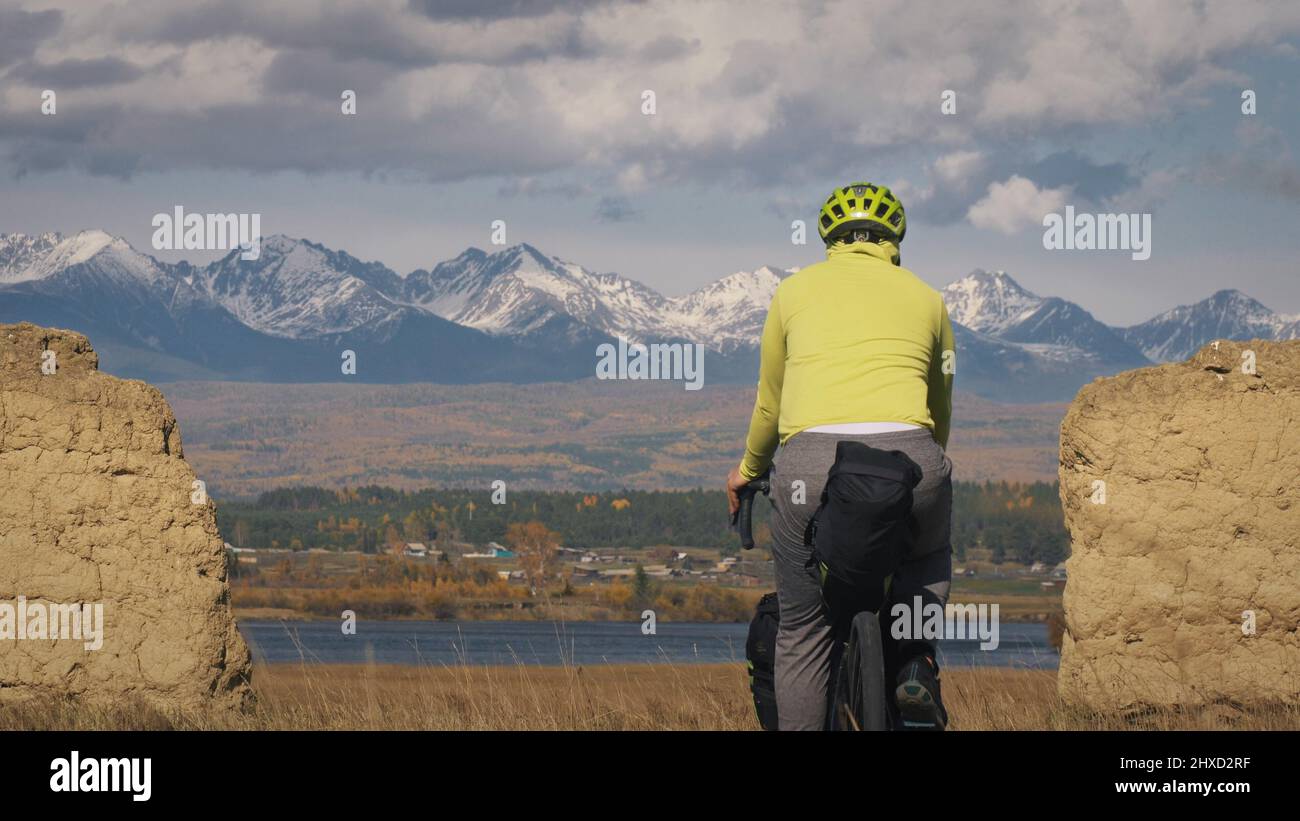 The man travel on mixed terrain cycle touring with bikepacking. The ...