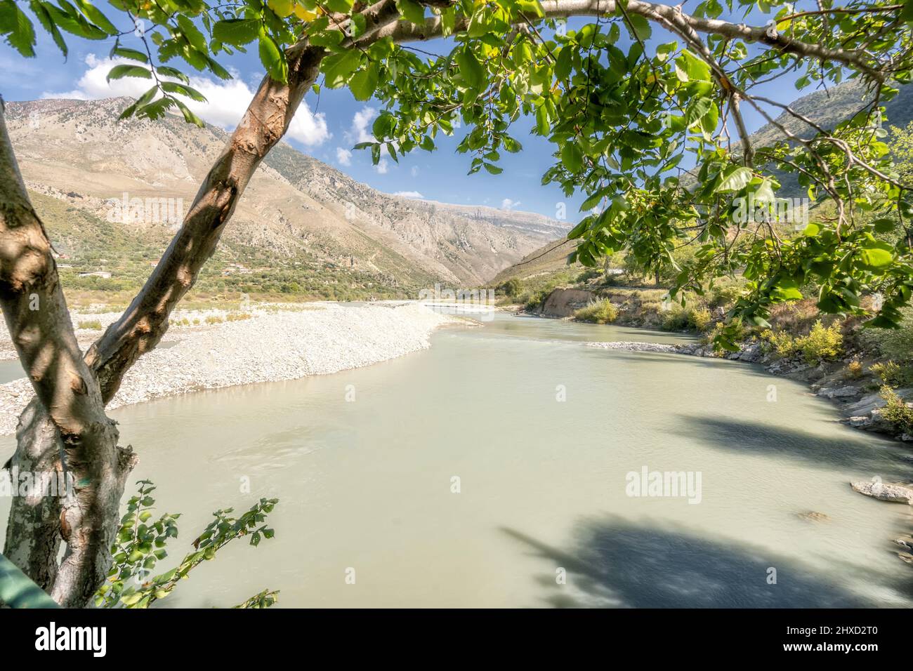 Beautiful mountain valley with gentle hills and river Stock Photo - Alamy