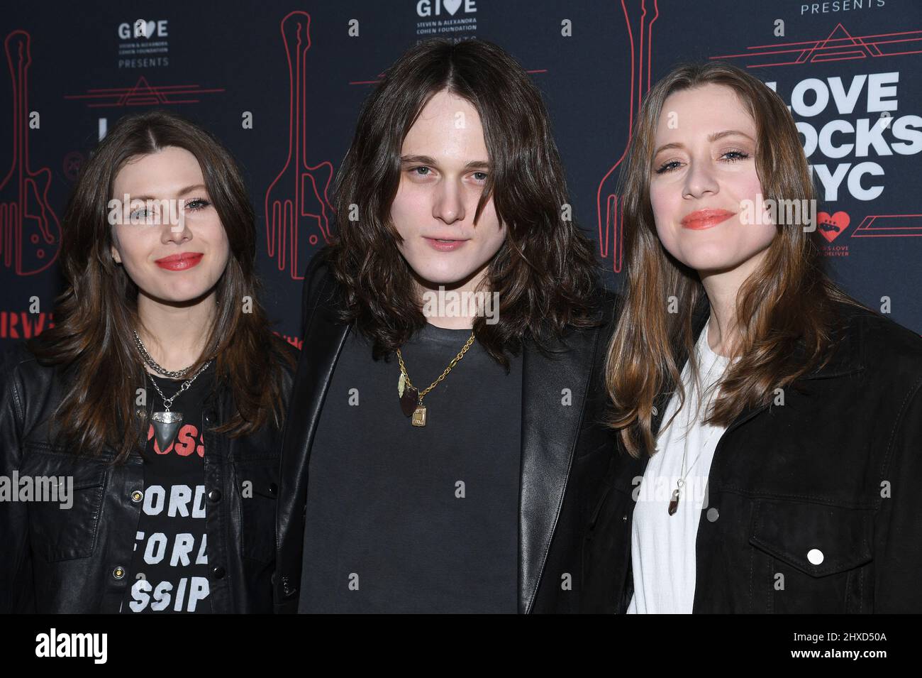 Rebecca Lovell (L) and Megan Lovell of Larkin Poe pose with Tyler ...