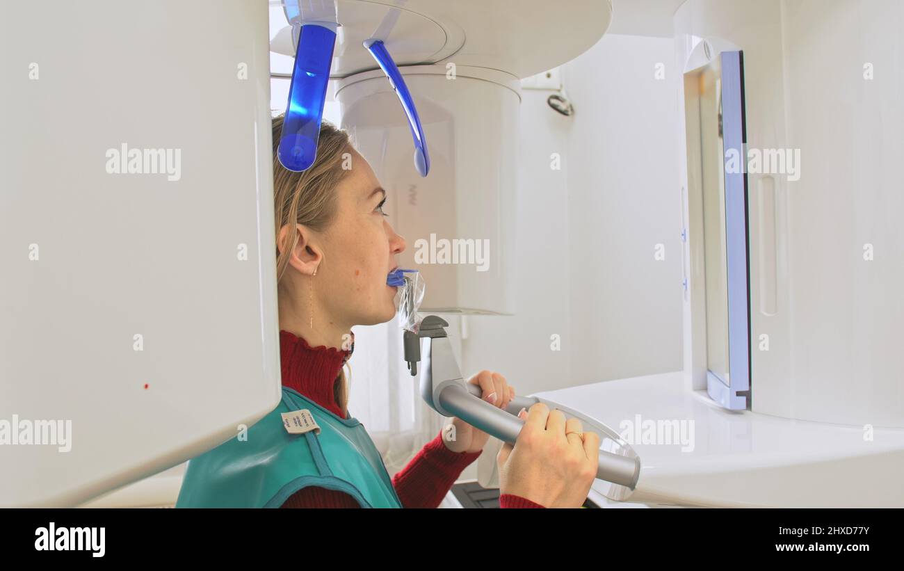 Doctor to take a image 3d scanner tomography of teeth and jaw in modern ...