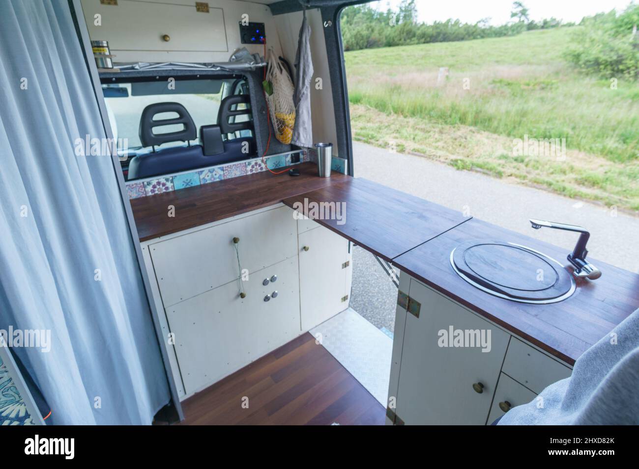 bright white and brown interior of a self made camper van transporter ...