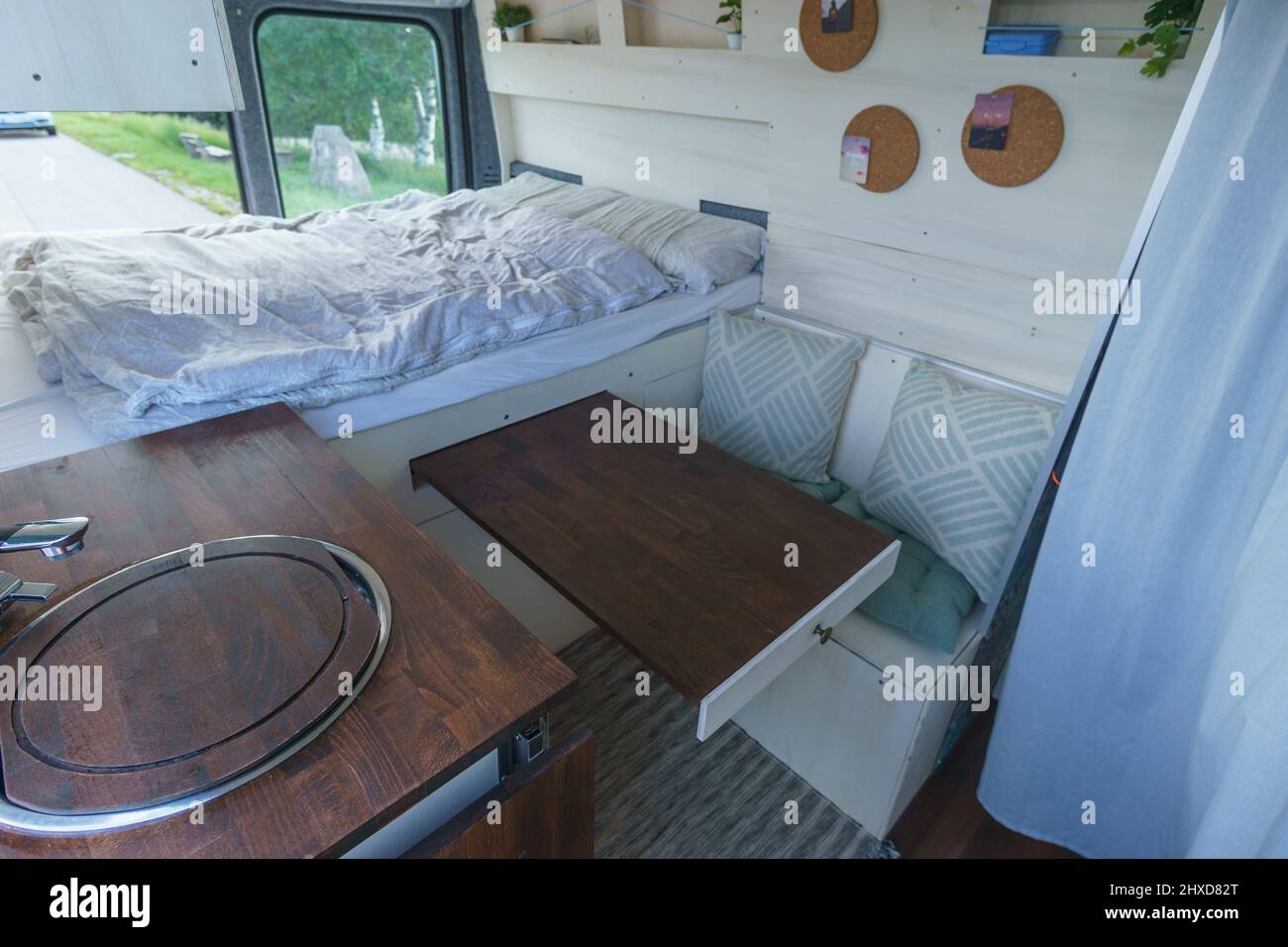 bright white and brown nterior of a self made camper van transporter ...