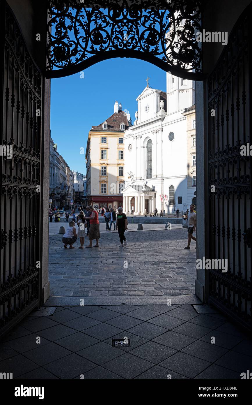 Michaelerkirche, St. Michaels church on Michaelerplatz square on bright ...