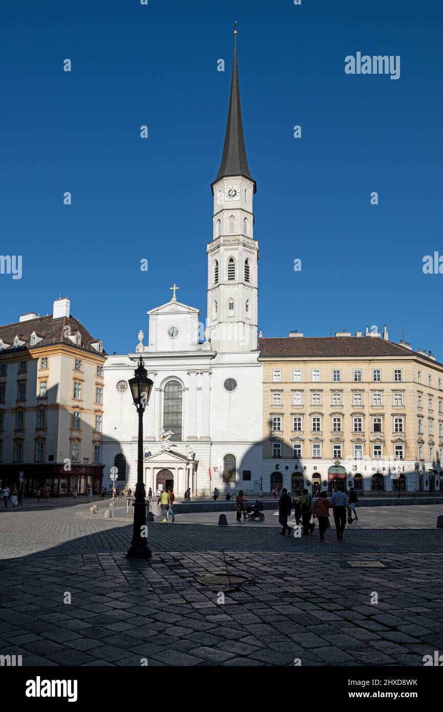 Michaelerkirche, St. Michaels church on Michaelerplatz square on bright ...