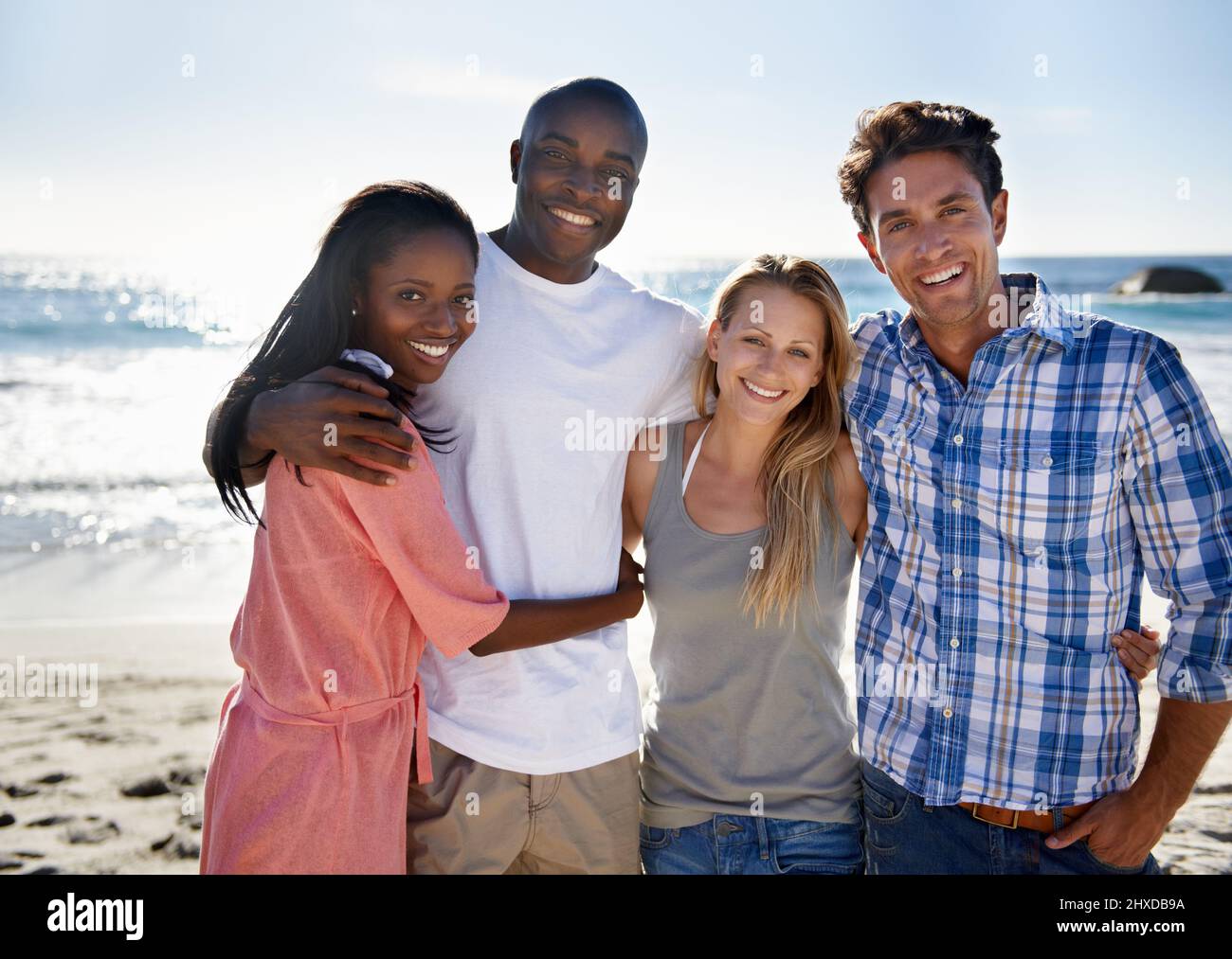 Double beach date. Cropped portrait of two happy couples enjoying a day ...