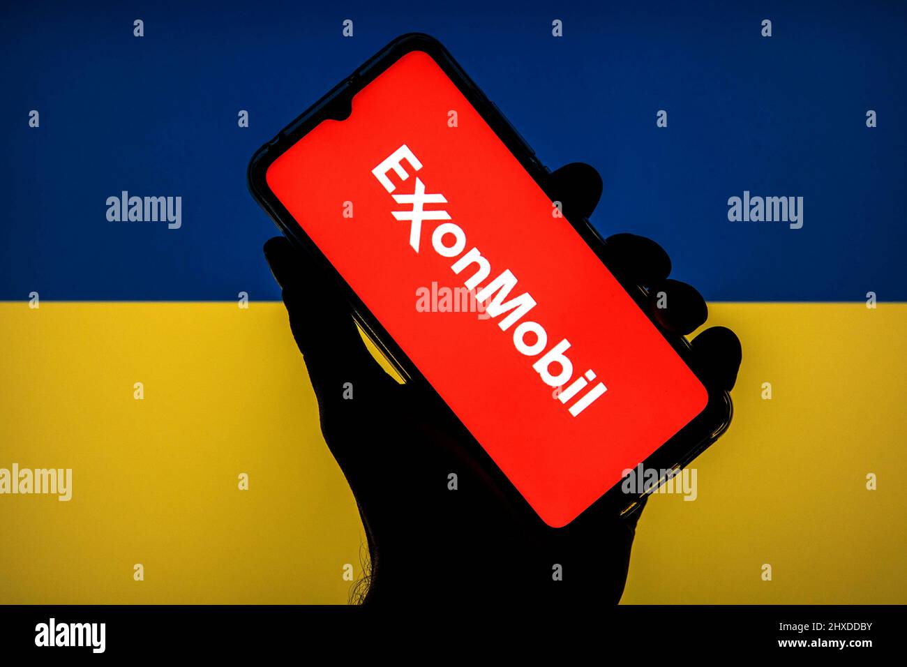 In this photo illustration an ExxonMobil logo seen displayed on a ...