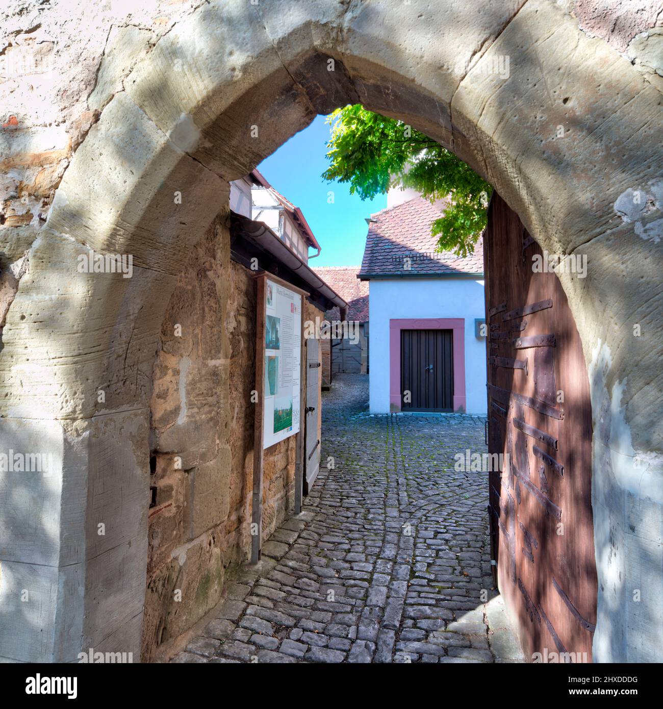 Church castle, pointed arch gate, house facade, autumn, market ...