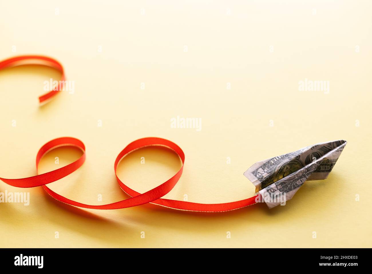 Paper plane made of one dollar bill Stock Photo - Alamy