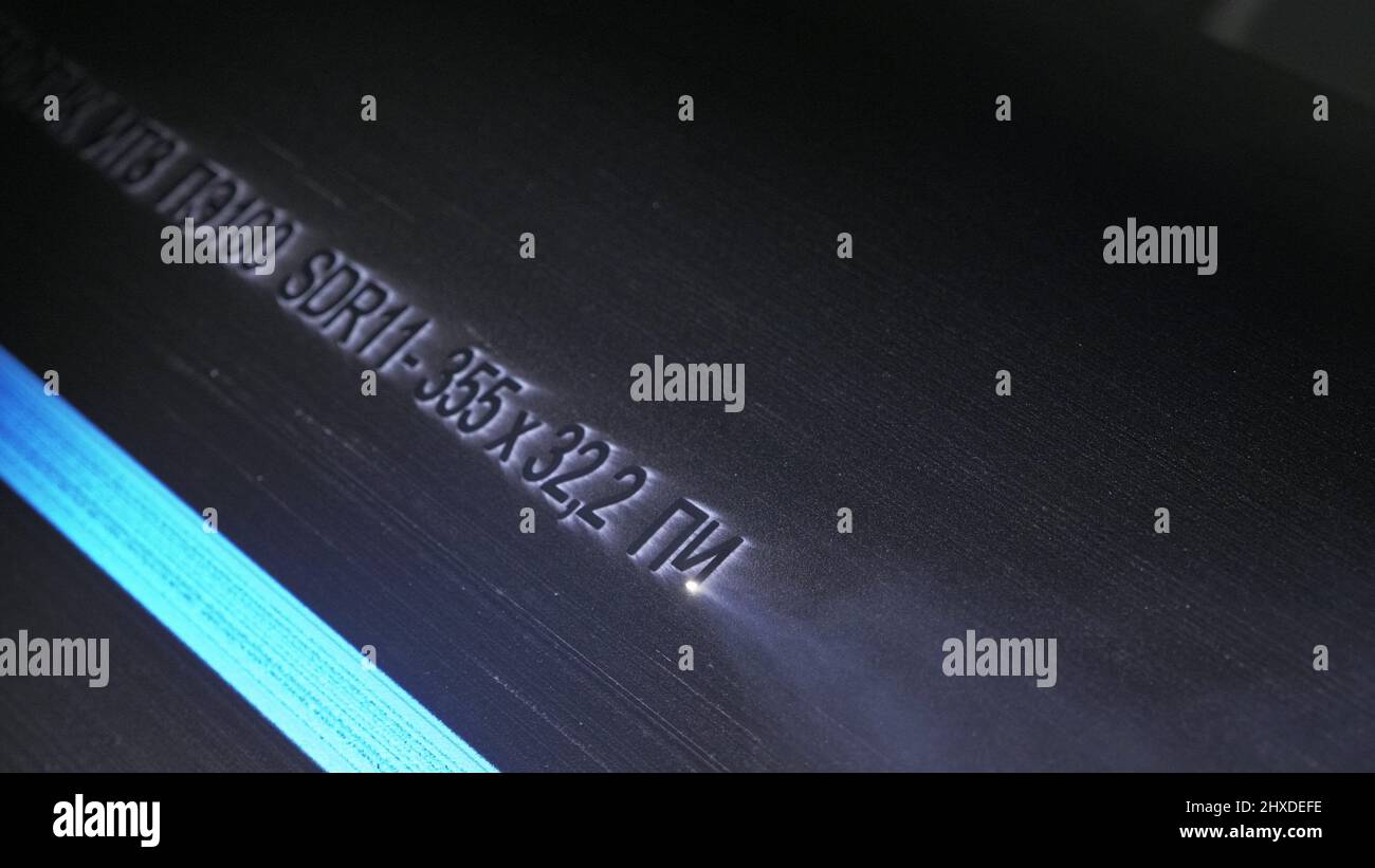 Laser Marking Machine Engraving. Manufacture of plastic water pipes of ...