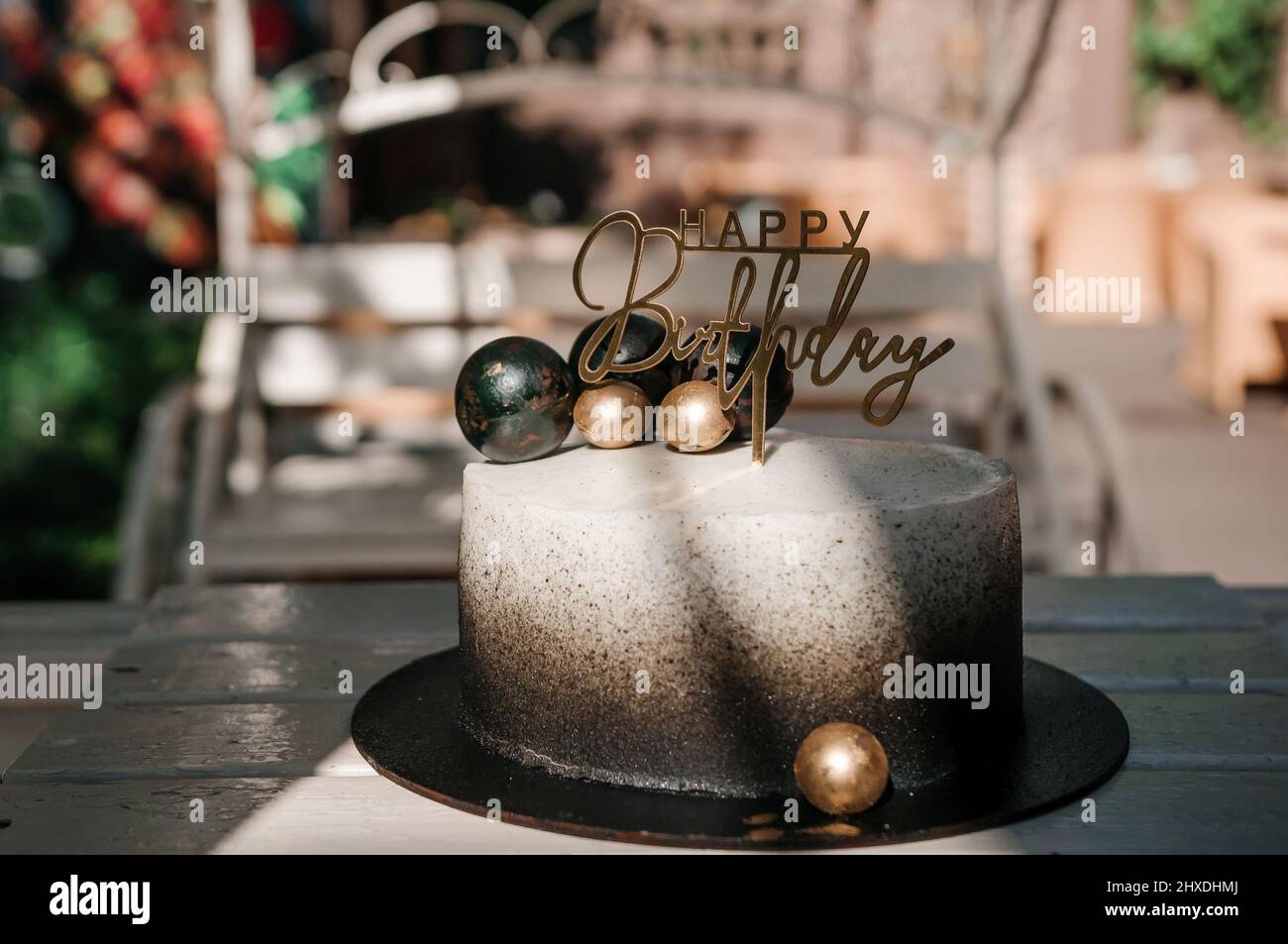 Beautiful cake, birthday cake blurred background Stock Photo - Alamy