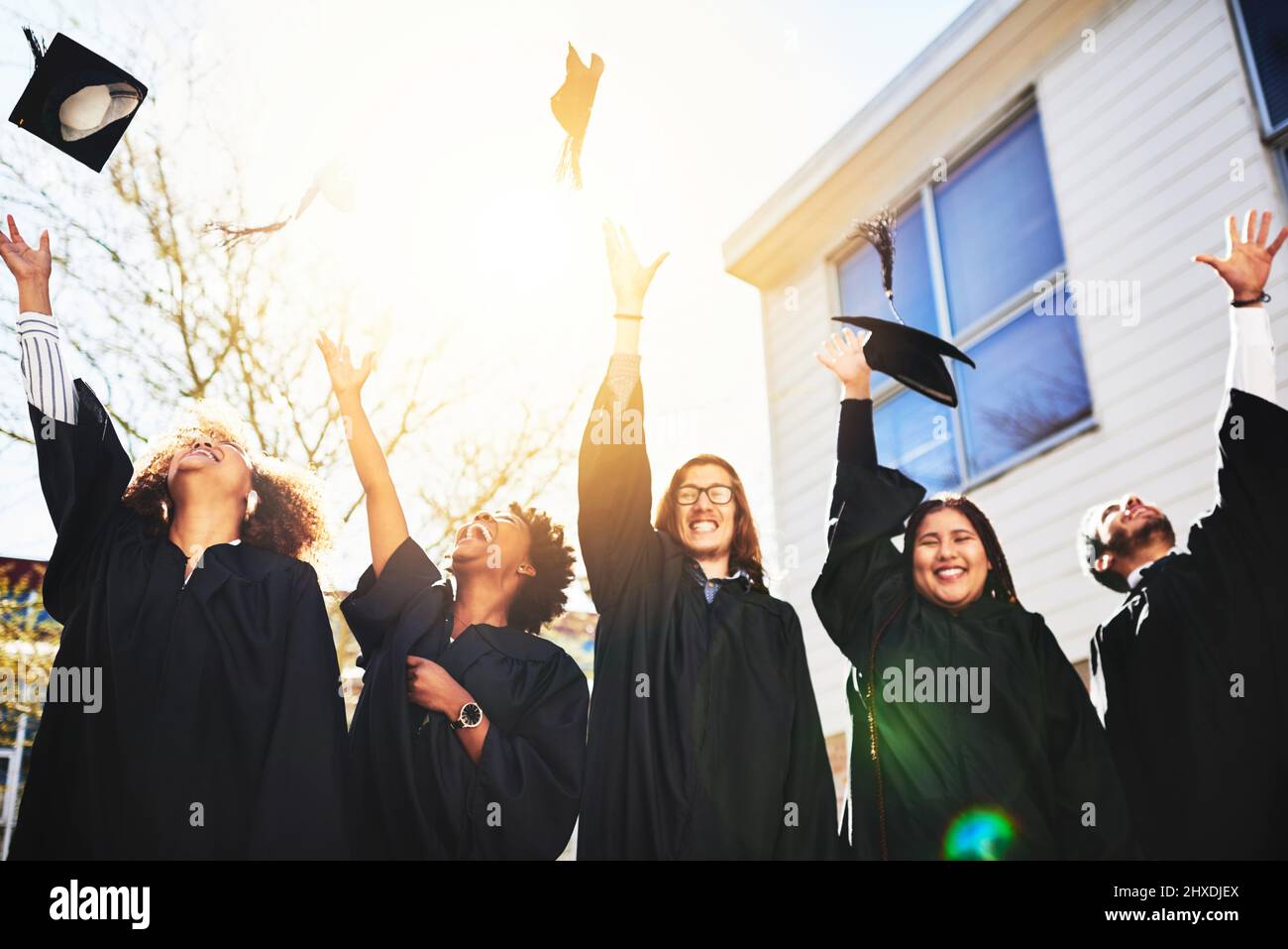 College students graduation caps air hi-res stock photography and ...