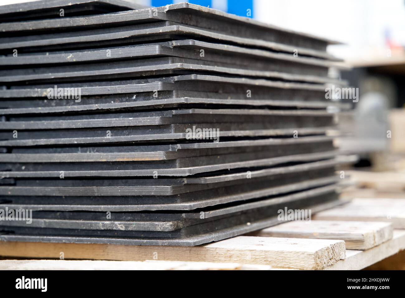 Pile of recycled plastic construction material made from restmix waste ...