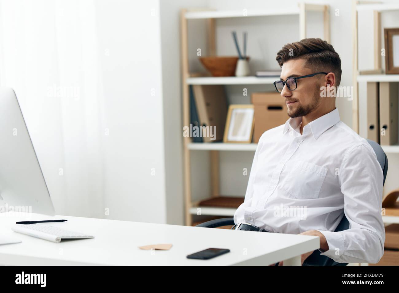 businessmen in a white shirt sits at a computer work office Stock Photo ...
