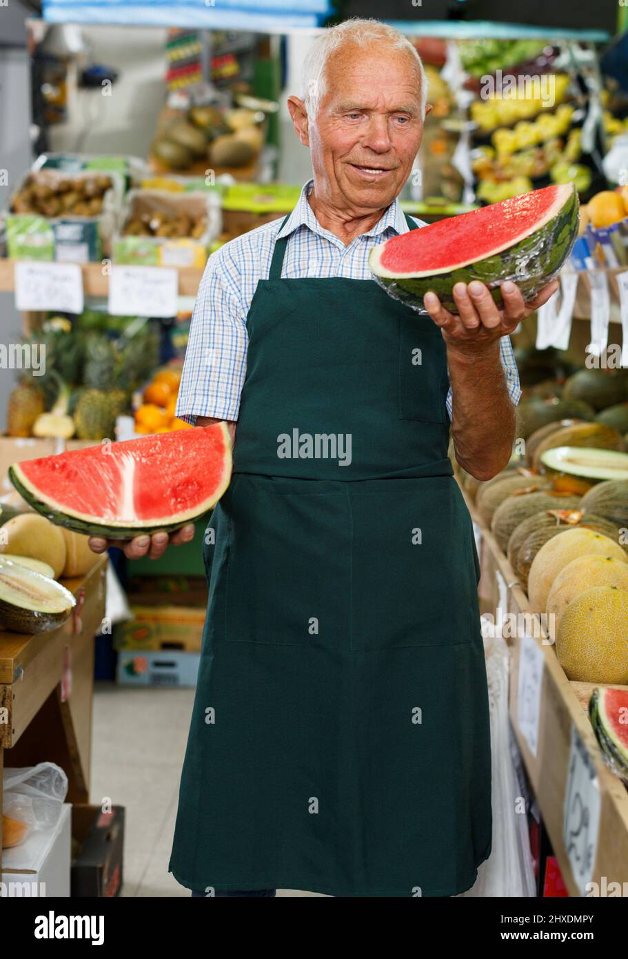 Owner of greengrocery offering fruits and vegetables Stock Photo - Alamy