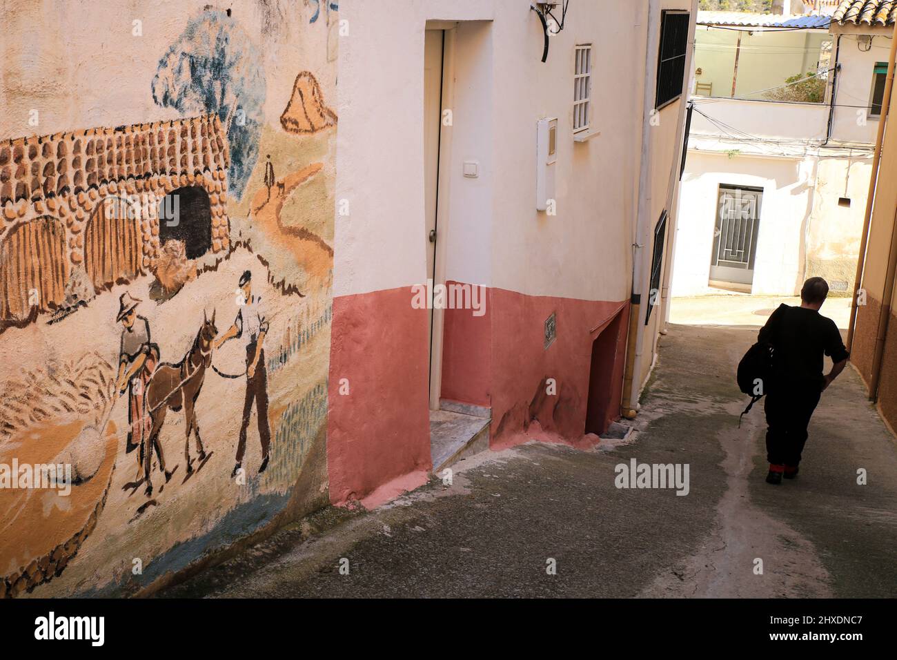 Bolulla, Alicante, Spain- February 4, 2022: Narrow Street and typical ...