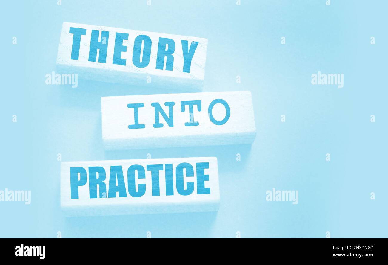 Theory into practice words written on wooden blocks. Education or ...