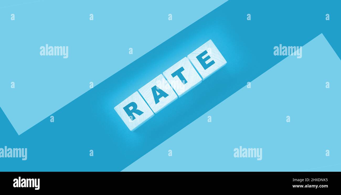 Rate word concept written on wooden cubes blocks lying on a black ...
