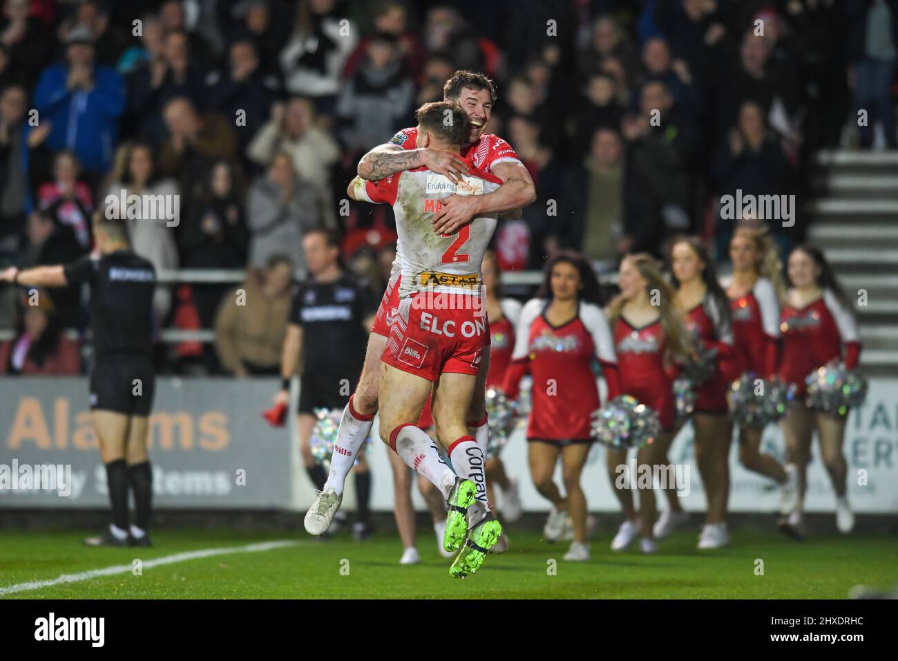 Tommy Makinson #2 of St Helens celebrates scoring a try with Mark ...