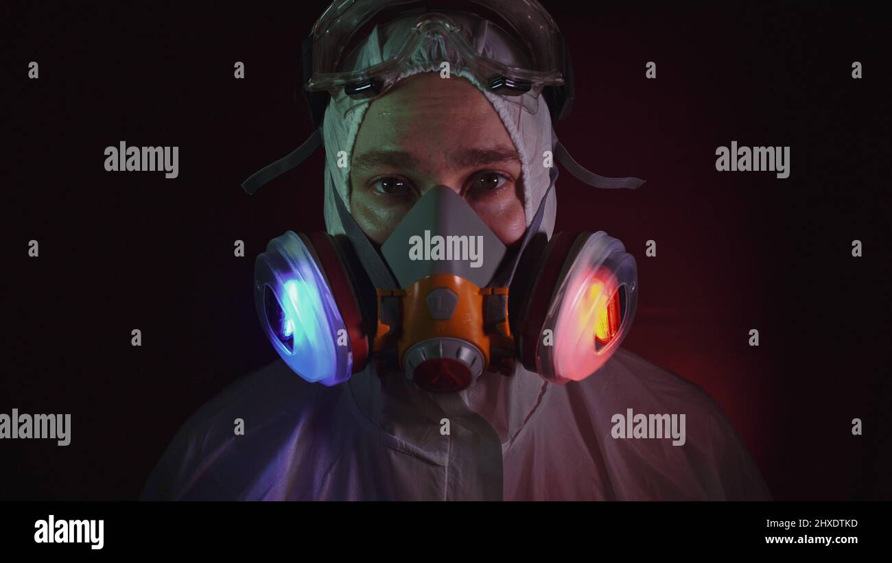 Man in protective costume suit, gas protect medical antibacterial ...