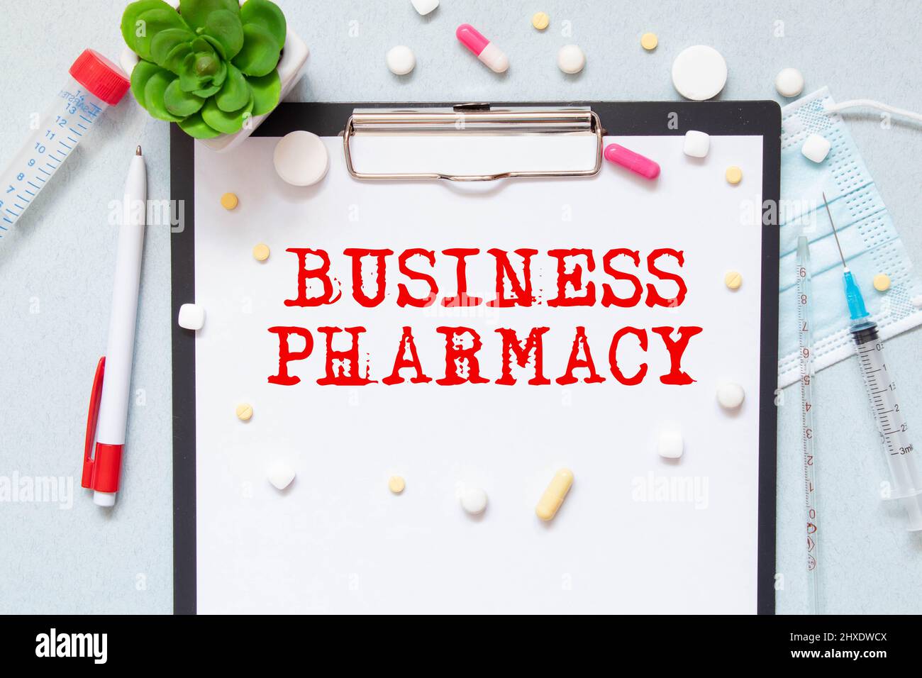 Text PHARMACY BUSINESS on a white background. Nearby are various ...