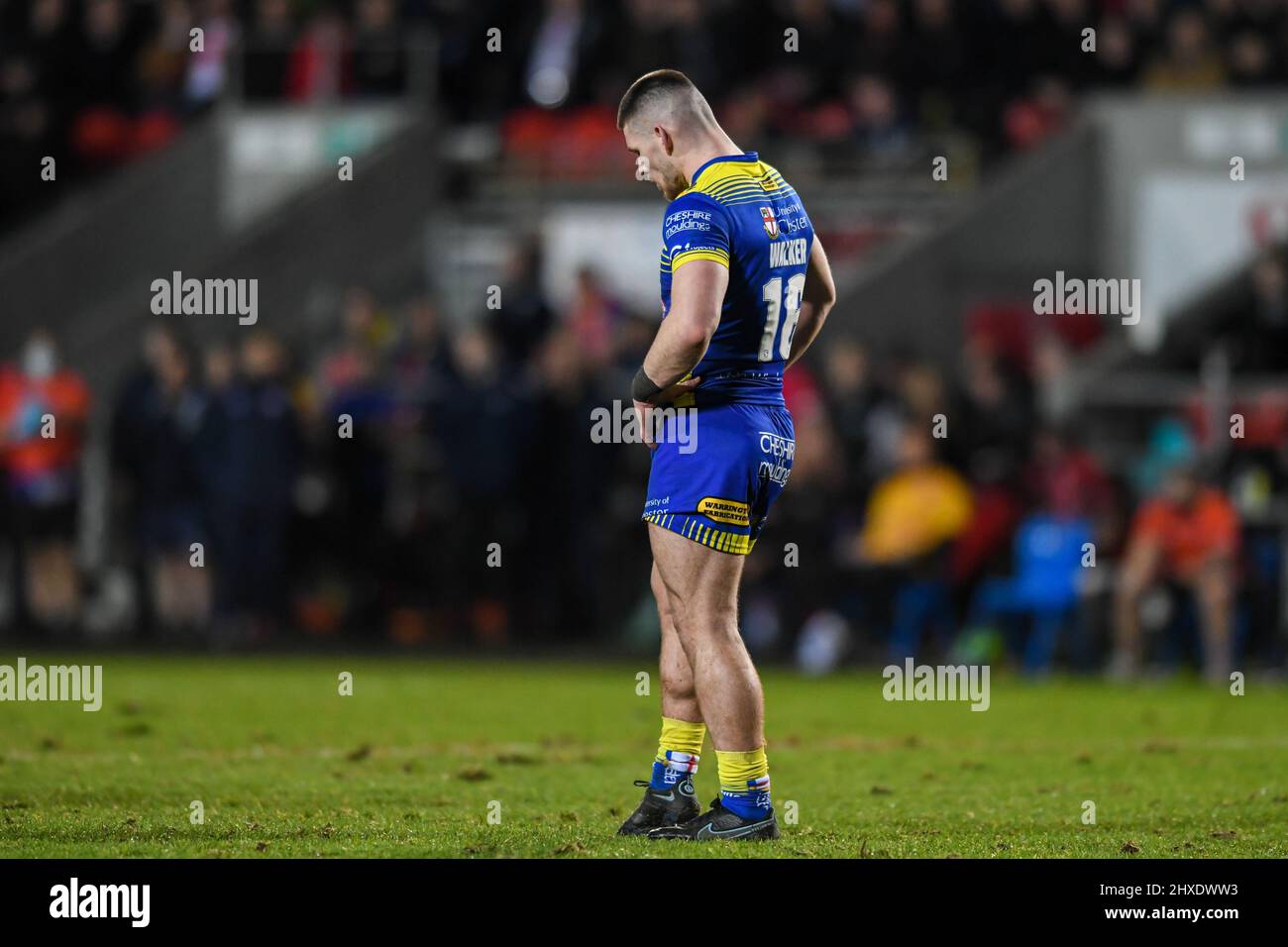 Danny Walker #16 of Warrington Wolves looks down at the ground during ...