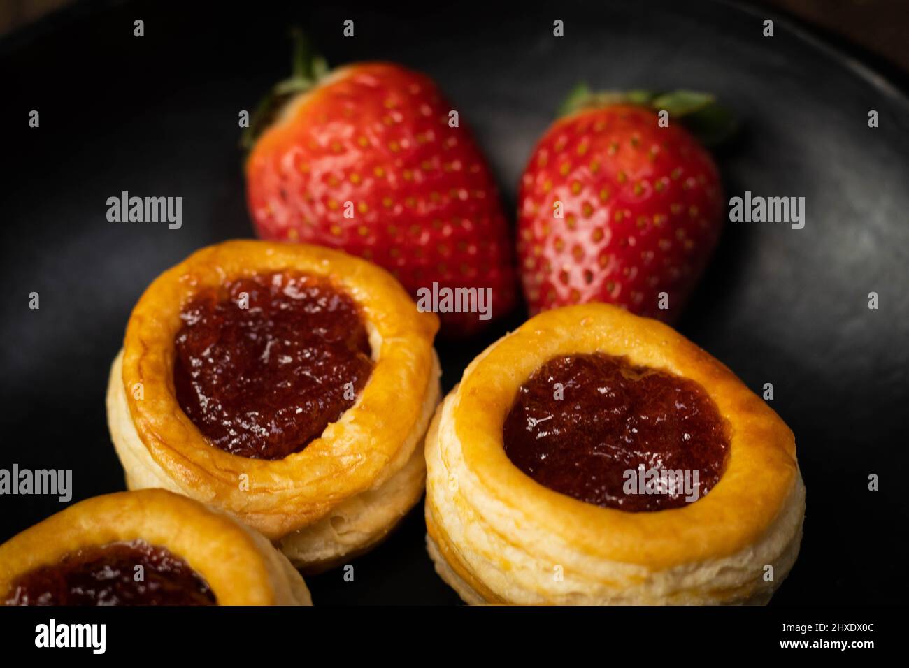 Delicious volovan for dessert filled with fruit jam Stock Photo - Alamy