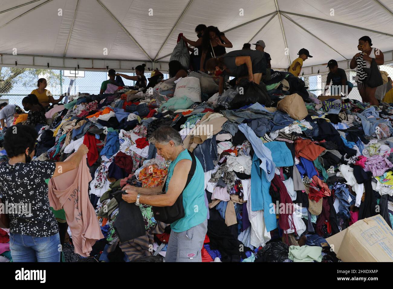 Homeless people collect clothes from donations. Victims of natural ...