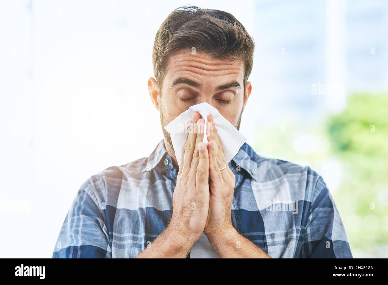 Going t have to stock up on tissues. Portrait of an uncomfortable ...