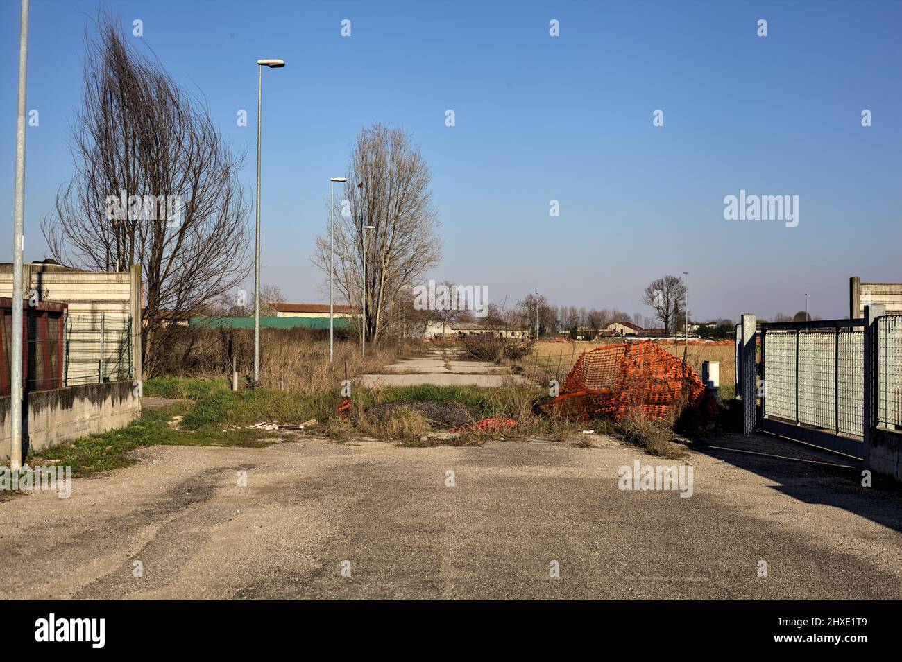 Blocked road between buildings in the countryside Stock Photo - Alamy