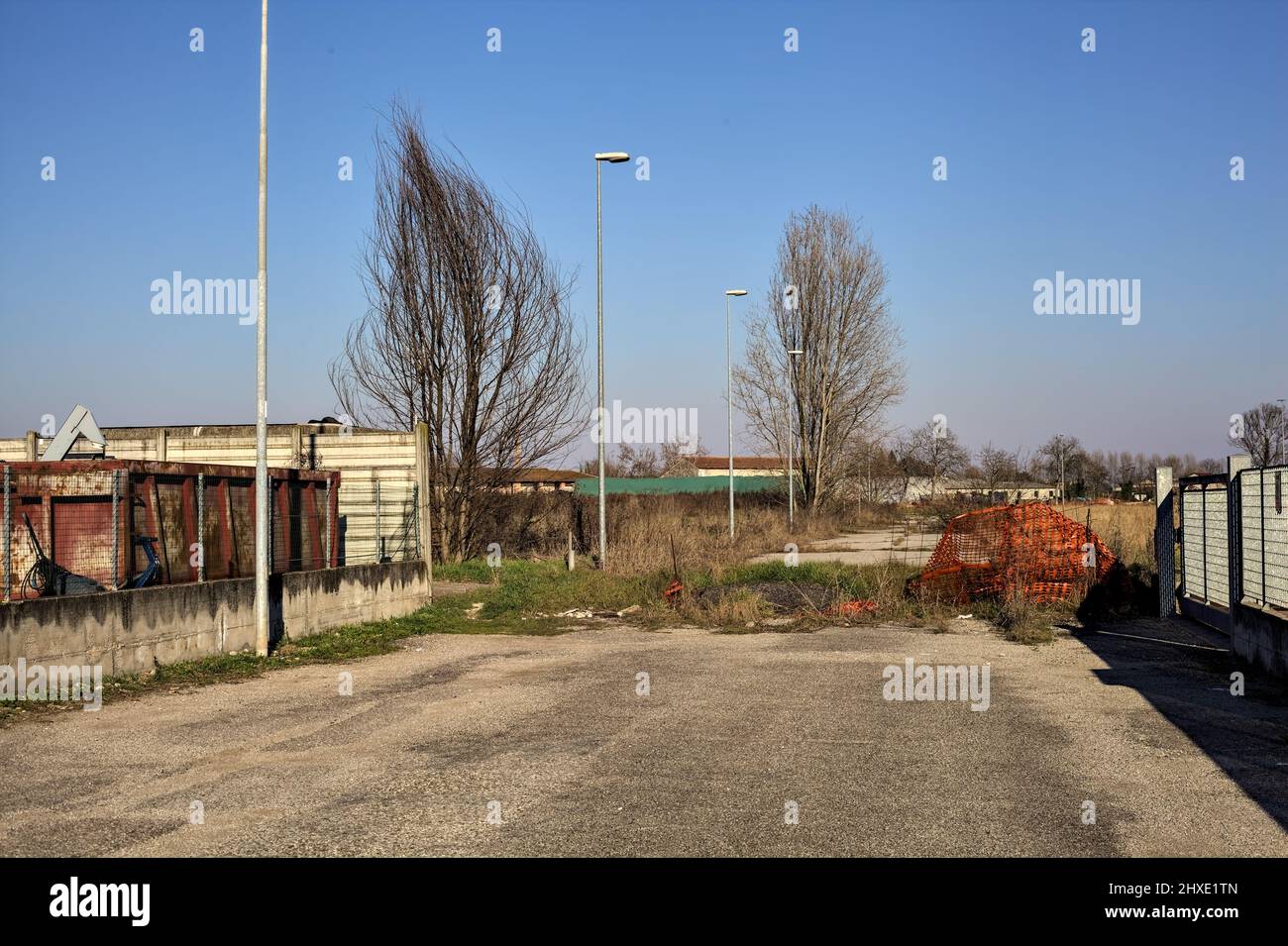 Blocked road between buildings in the countryside Stock Photo - Alamy