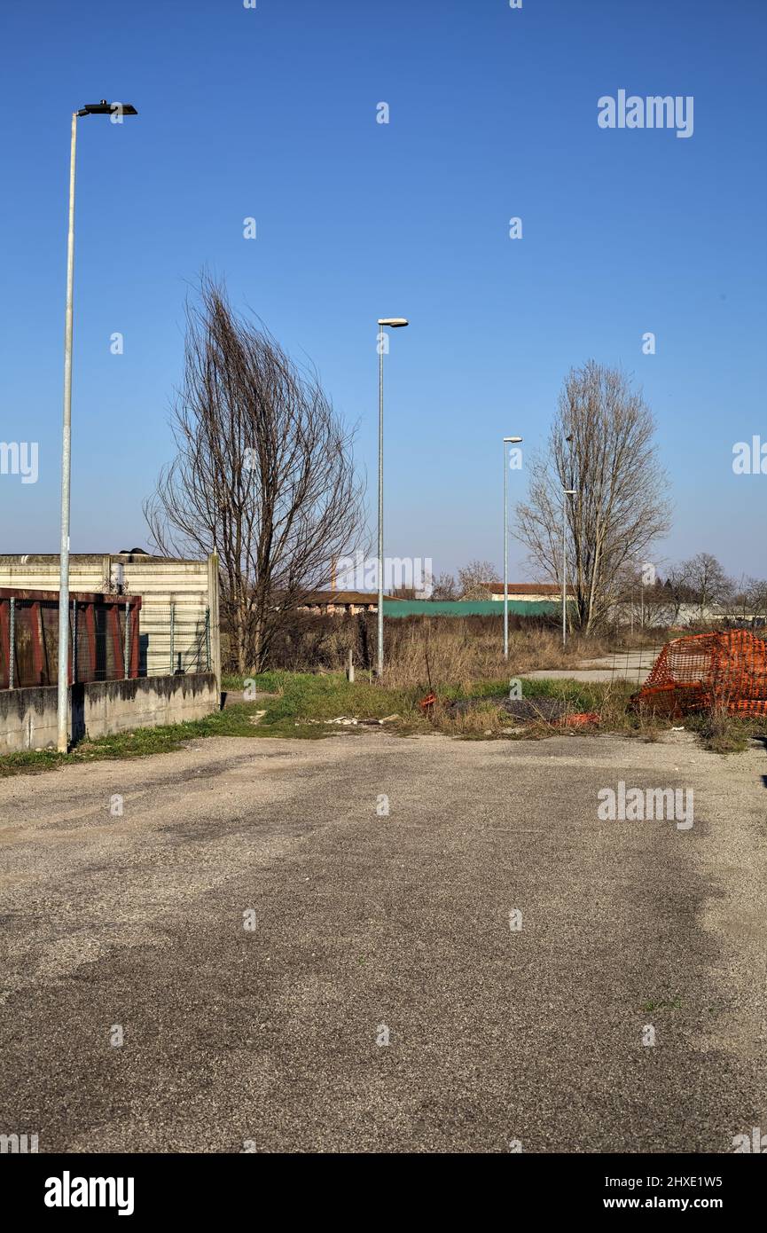 Blocked road between buildings in the countryside Stock Photo - Alamy
