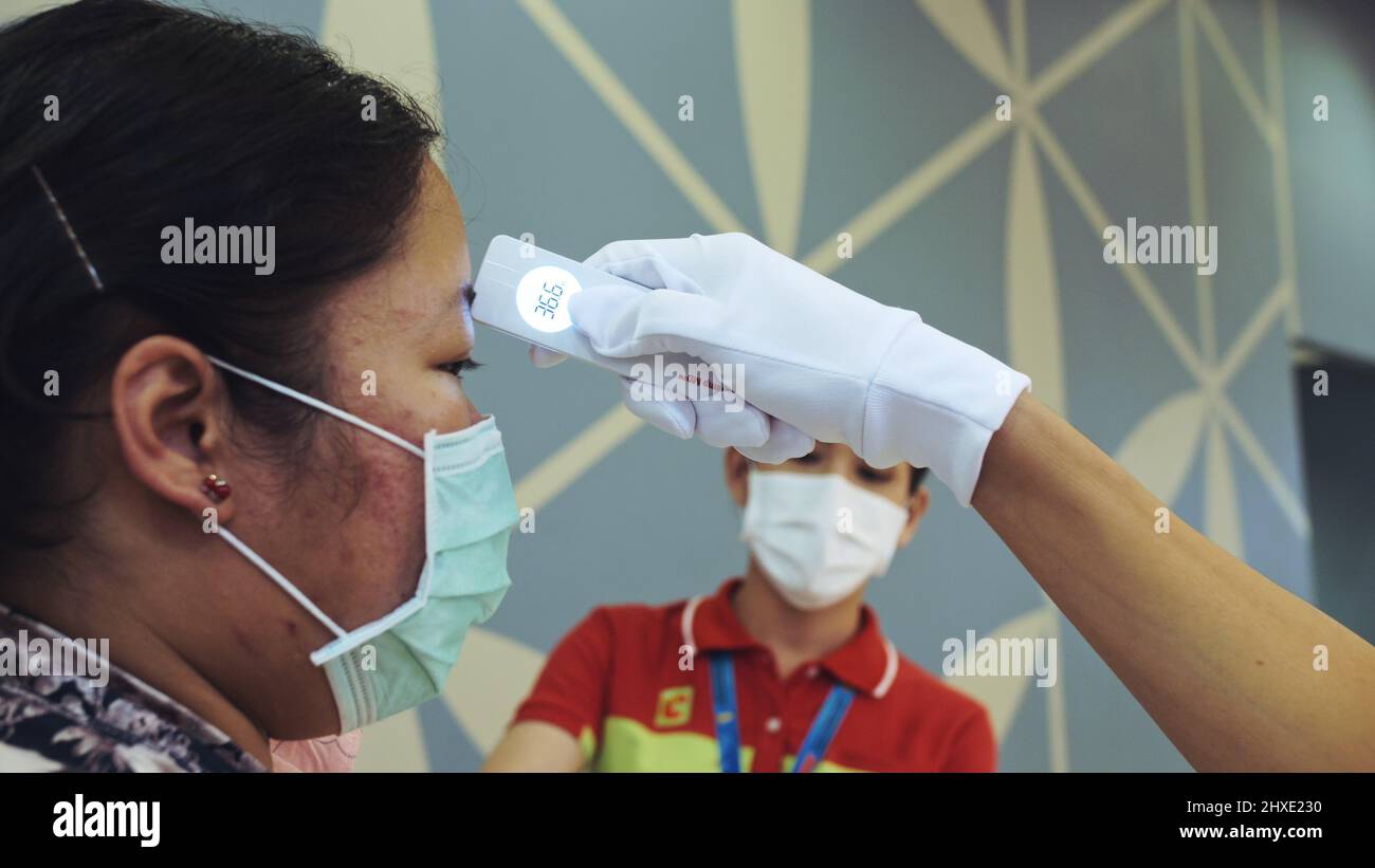 PATTAYA, THAILAND - MARCH 20, 2020: Temperature check at supermarket ...