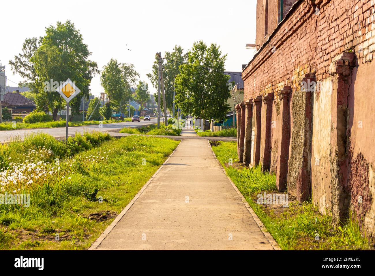 street of a small settlement with individual buildings and a brick ...