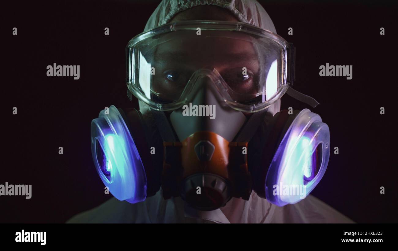 Man in protective costume suit, gas protect medical antibacterial ...