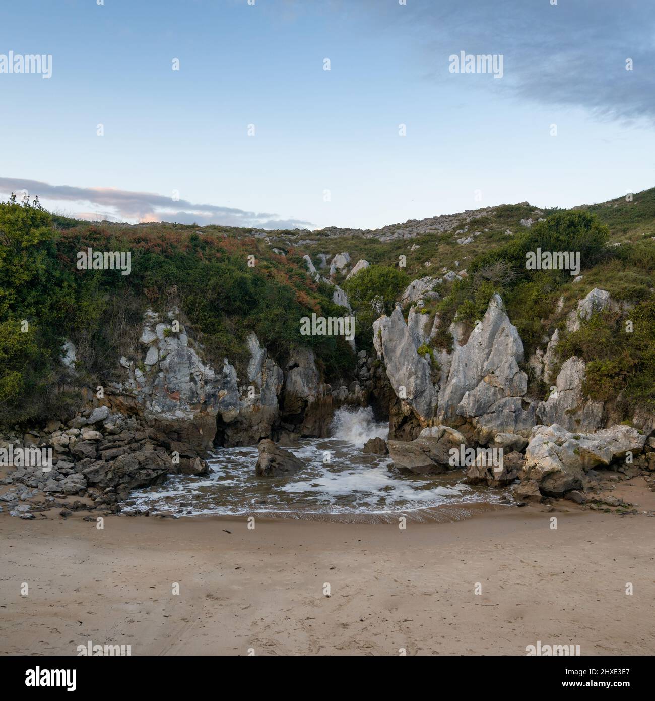 Unique Gulpiyuri inland beach with sea coming from the cliffs in ...
