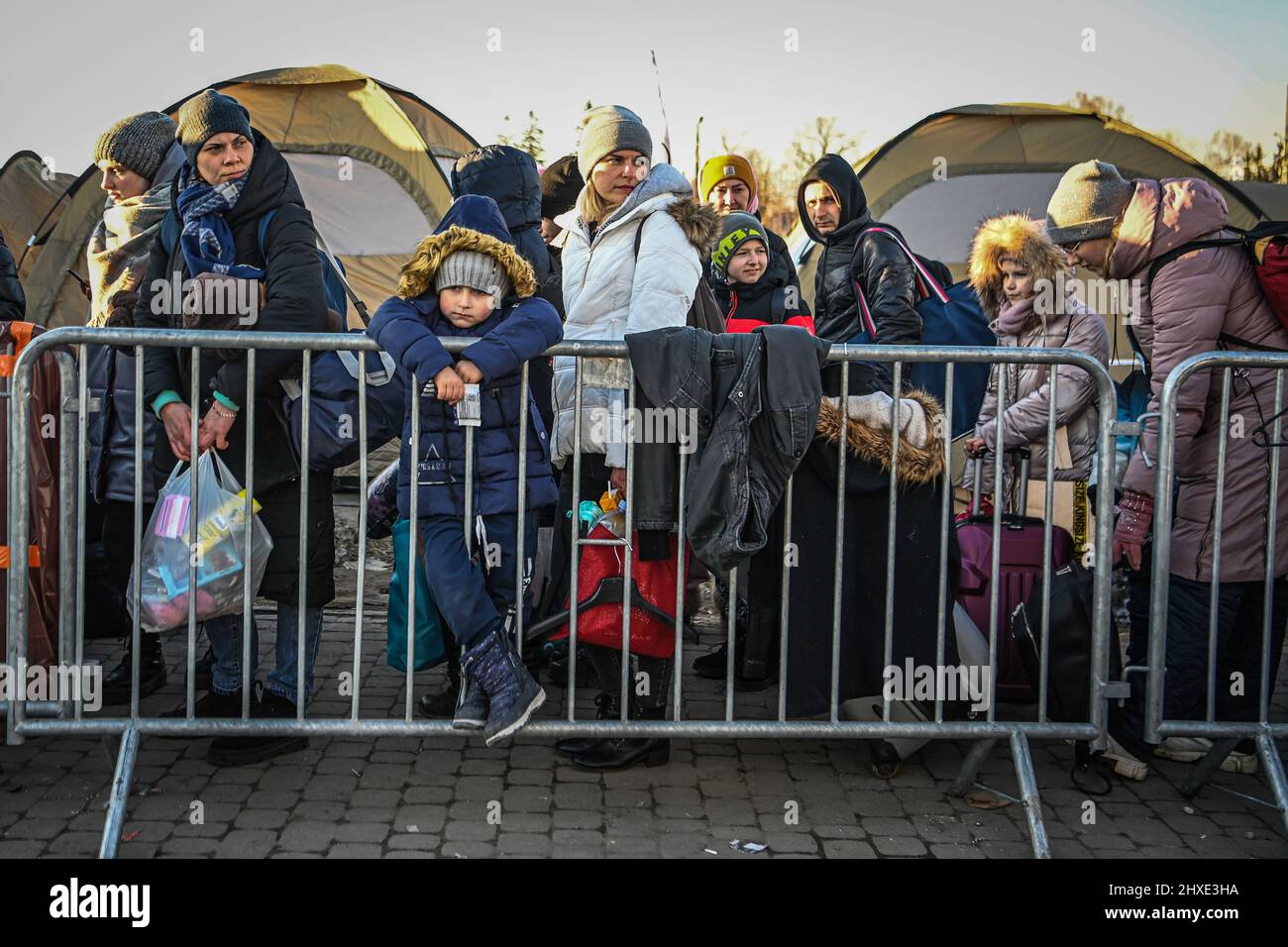 Medyka, Poland. 11th Mar, 2022. Ukrainian refugees wait to board busses ...